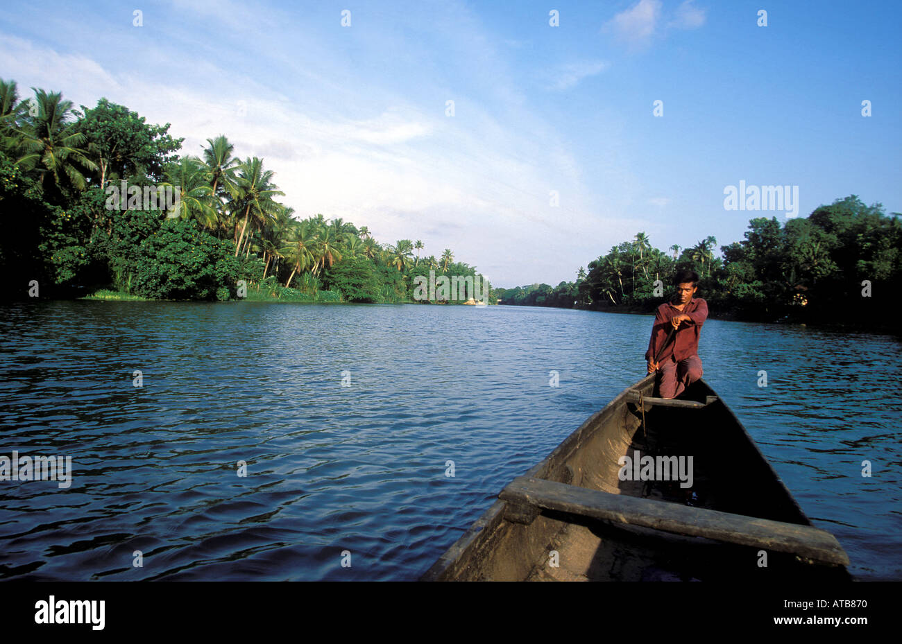 India Kerala A man cruising the Backwater canals near Kottayam Stock ...