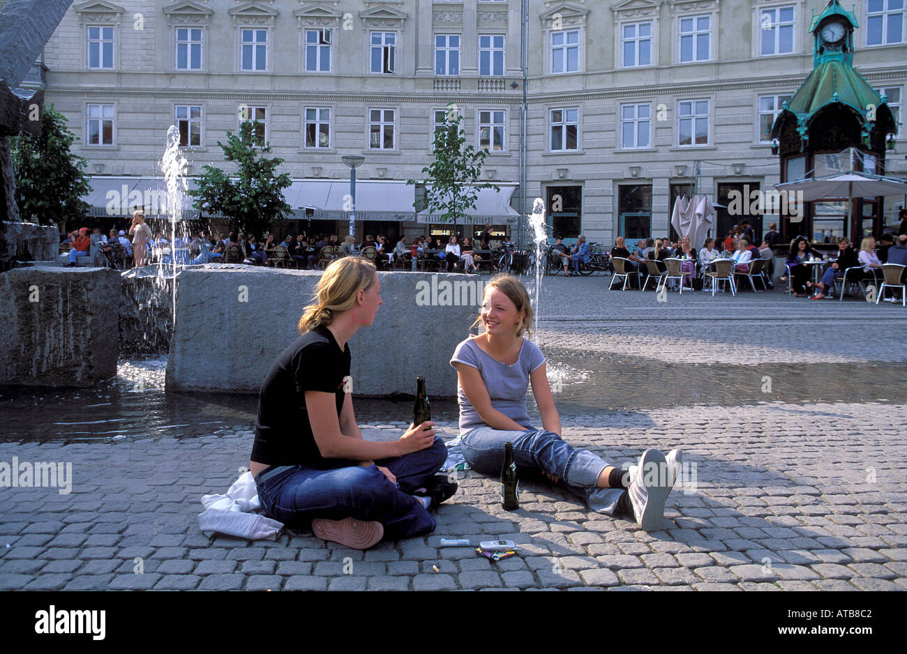 Denmark Copenhagen young women sitting at Sankt Hans torv a popular ...