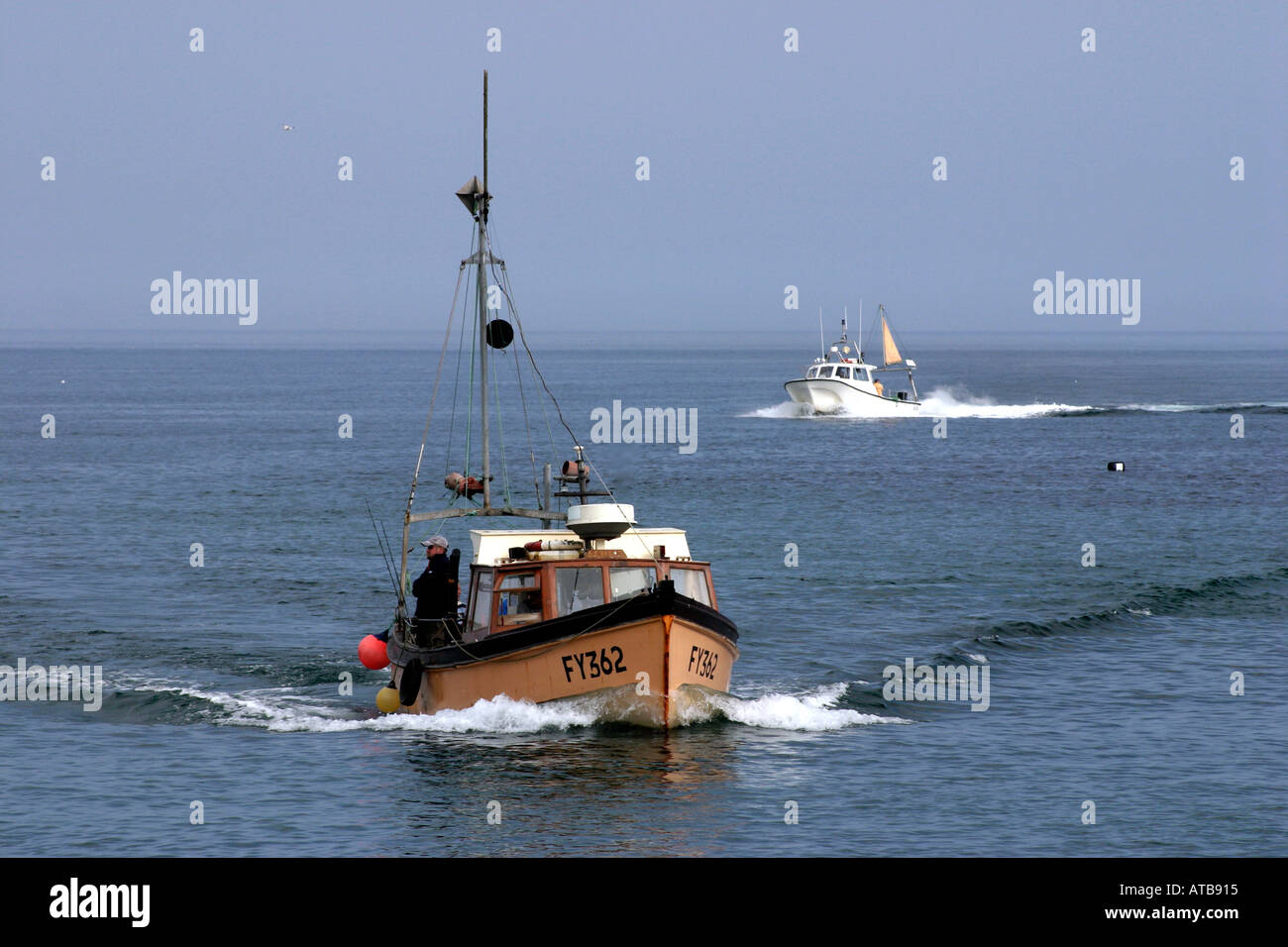 Fishing Boats returning to Looe Harbour after a day s fishing Stock ...