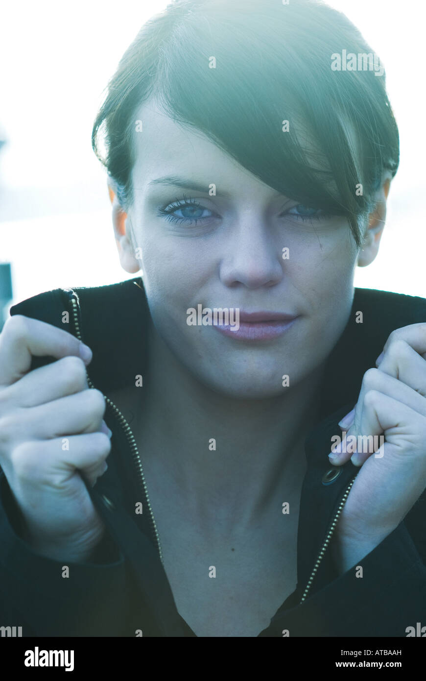 portrait of a young woman in back light Stock Photo - Alamy