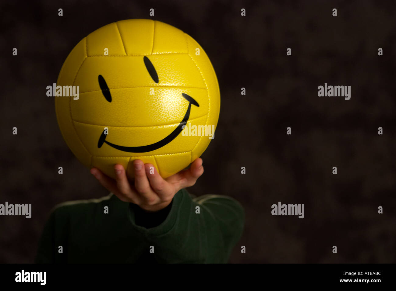 Boy with happy face ball Stock Photo - Alamy