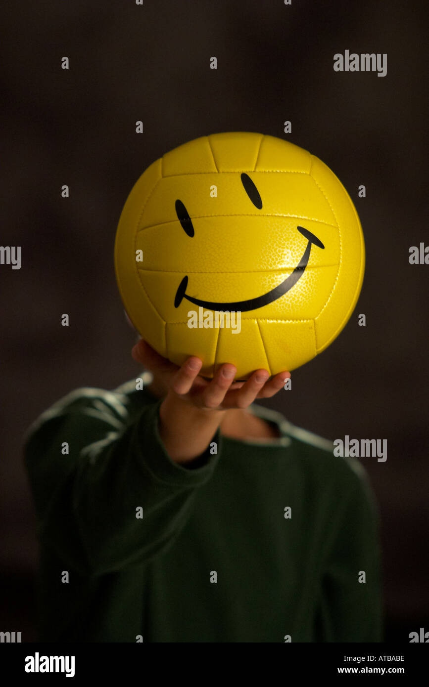 Boy with happy face ball Stock Photo - Alamy