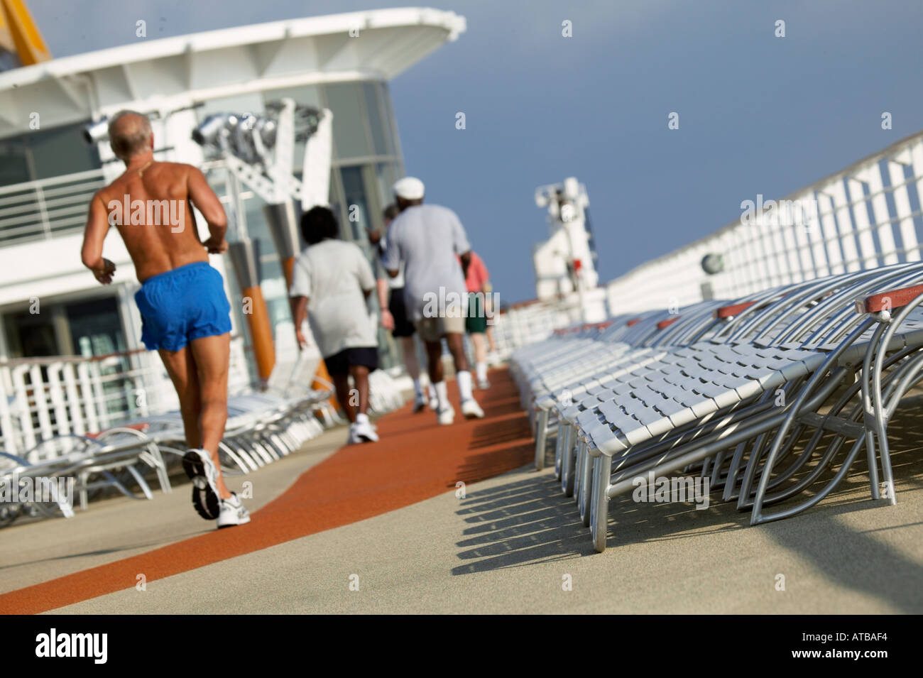Man running on Cruise Ship deck Stock Photo - Alamy