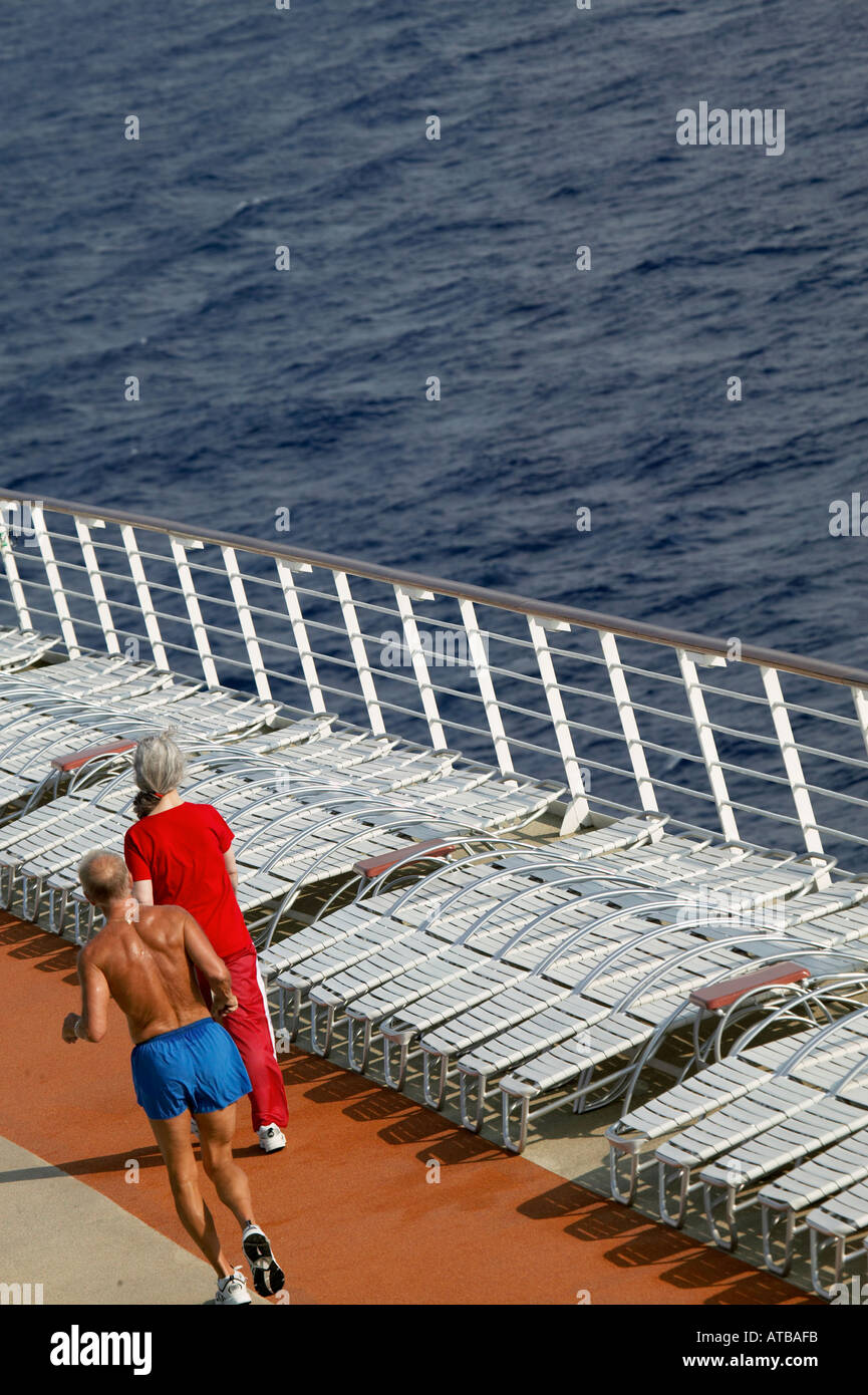Man and Woman running on Cruise Ship deck Stock Photo - Alamy