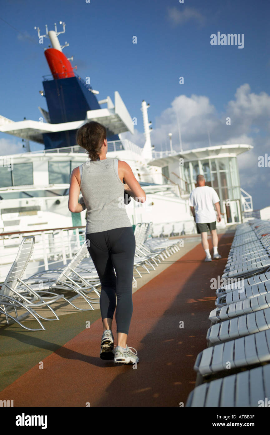 Woman running on Cruise Ship deck Stock Photo - Alamy