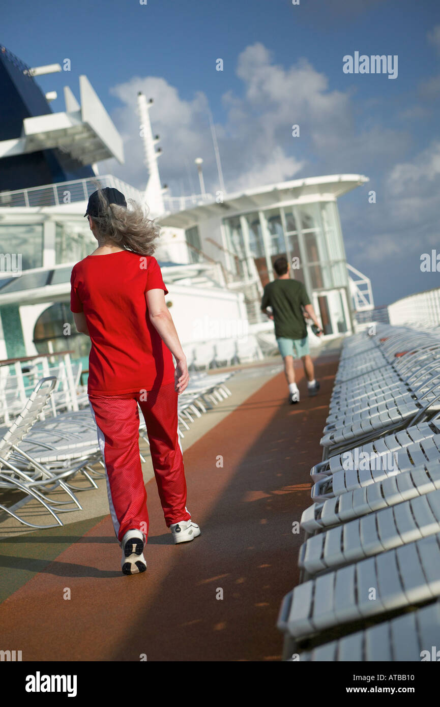 Woman running on Cruise Ship deck Stock Photo - Alamy