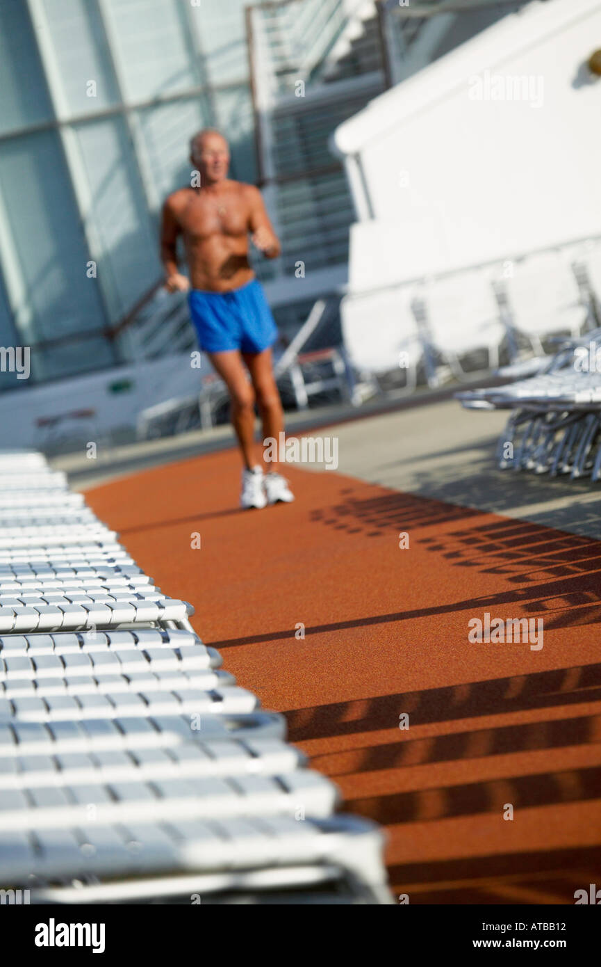 Man running on Cruise Ship deck Stock Photo - Alamy