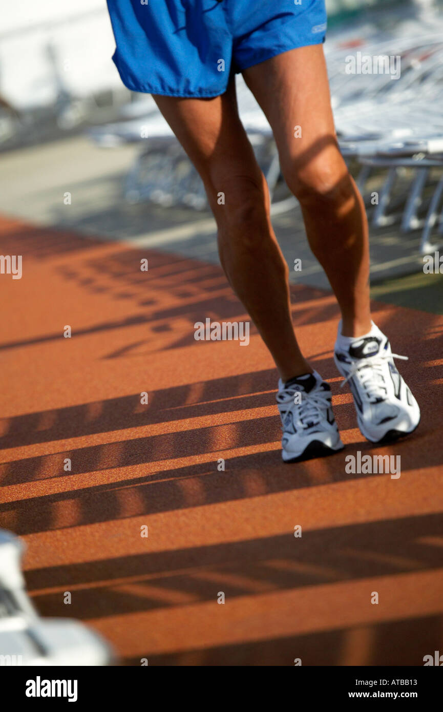 Man running on Cruise Ship deck Stock Photo - Alamy