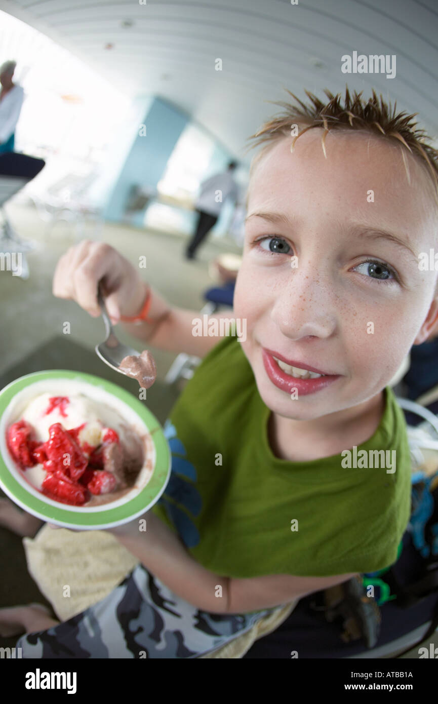 Preteen boy eating ice cream hi-res stock photography and images - Alamy