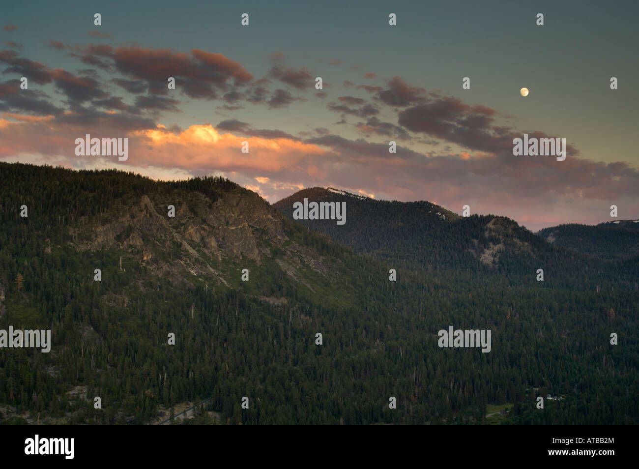 Moon rising over clouds and mountains at sunset from Echo Summit near ...
