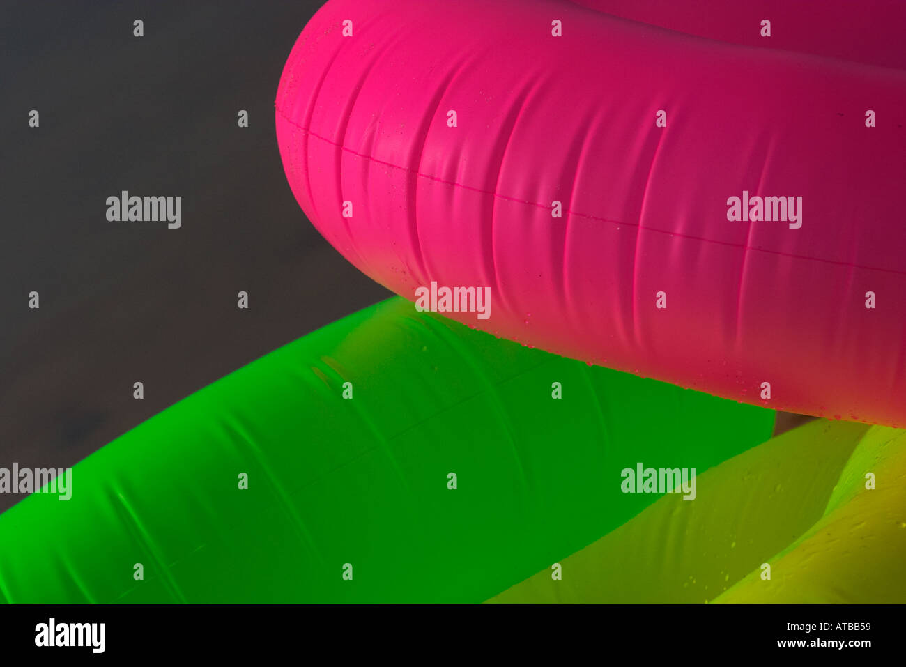 Colourful inflatable swimming tubes Stock Photo - Alamy