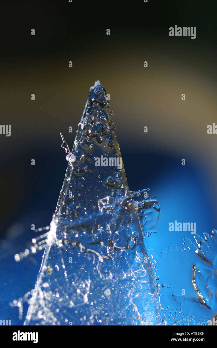 Ice spike against bright blue background Stock Photo - Alamy