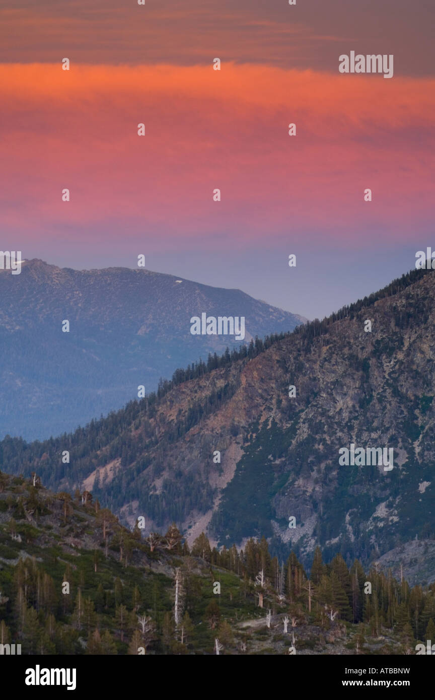 Alpenglow on clouds at sunset over mountains from Desolation Wilderness ...