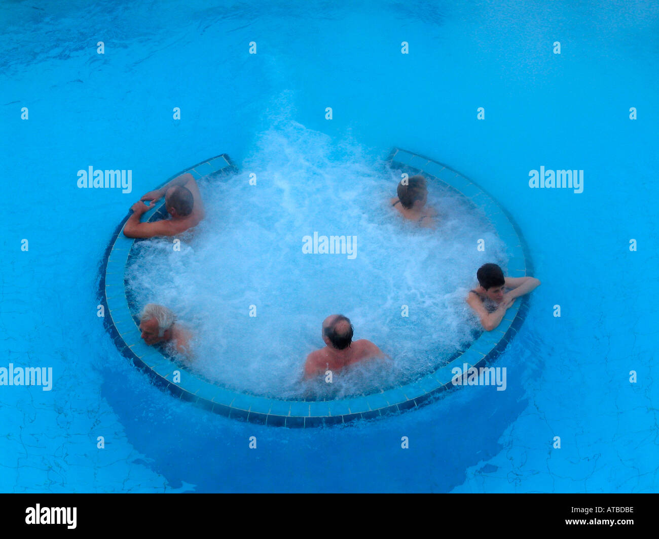 People bath in a medicinal hot water spring pool of Walliser ...