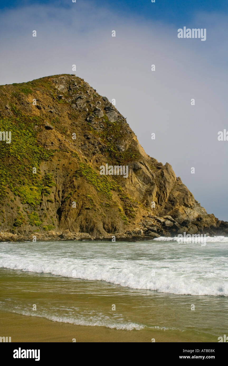 Ocean waves breaking on sand below coastal cliff at Pfeiffer Beach Big ...