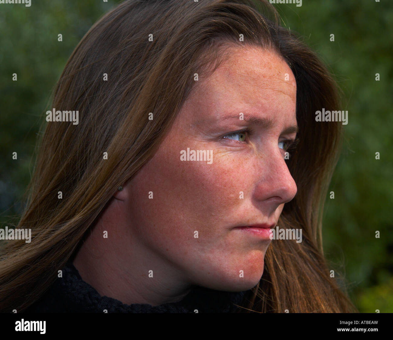 Woman looking longingly Stock Photo - Alamy