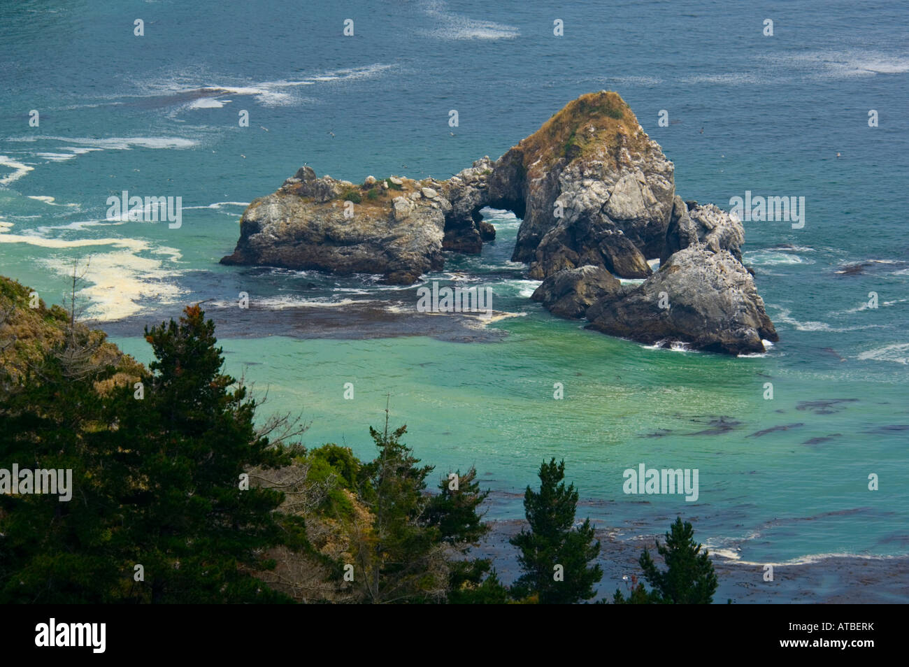 Offshore rock sea stacks in green ocean water along the Big Sur Coast ...