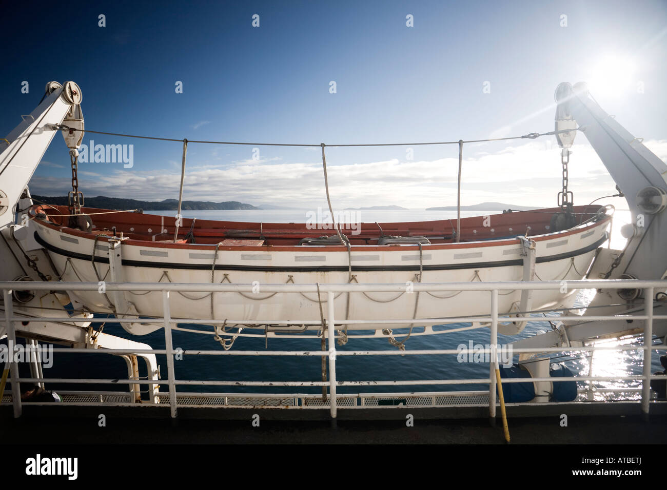 lifeboat hanging on a ferry boat Stock Photo - Alamy
