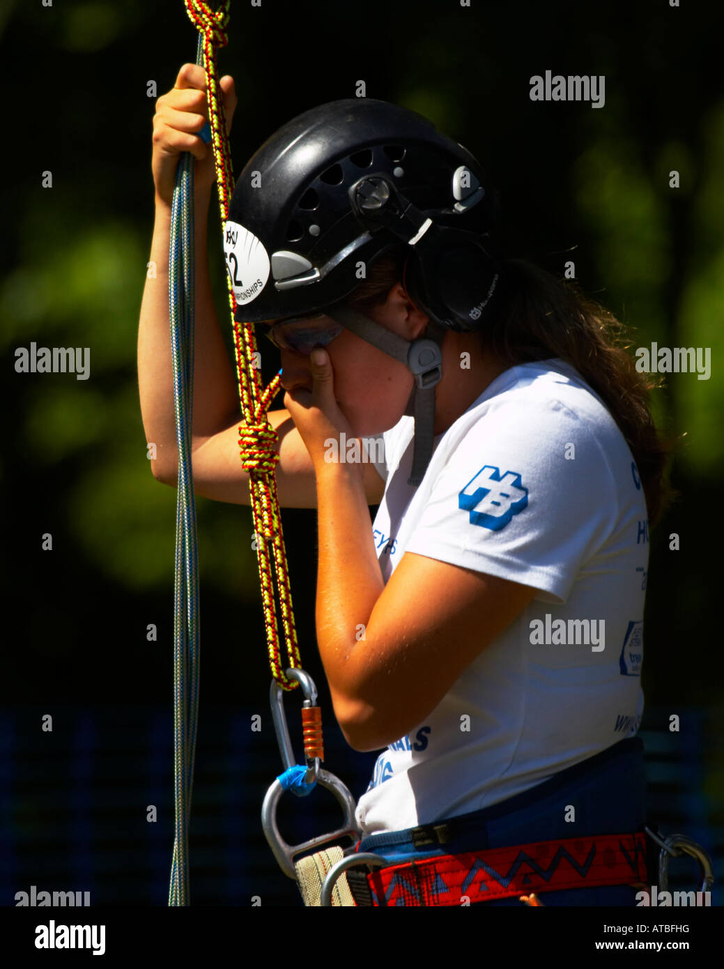 Female tree climbing competitor Stock Photo - Alamy