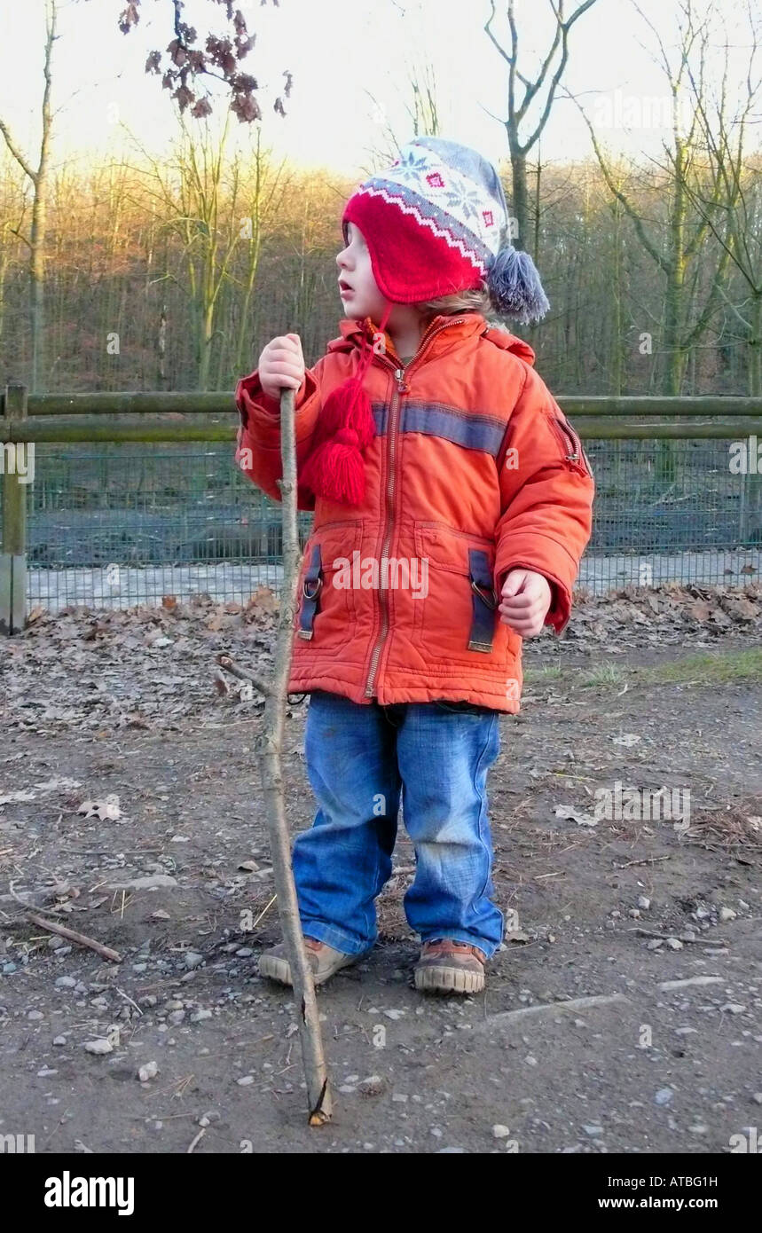 little boy with walking stick Stock Photo - Alamy