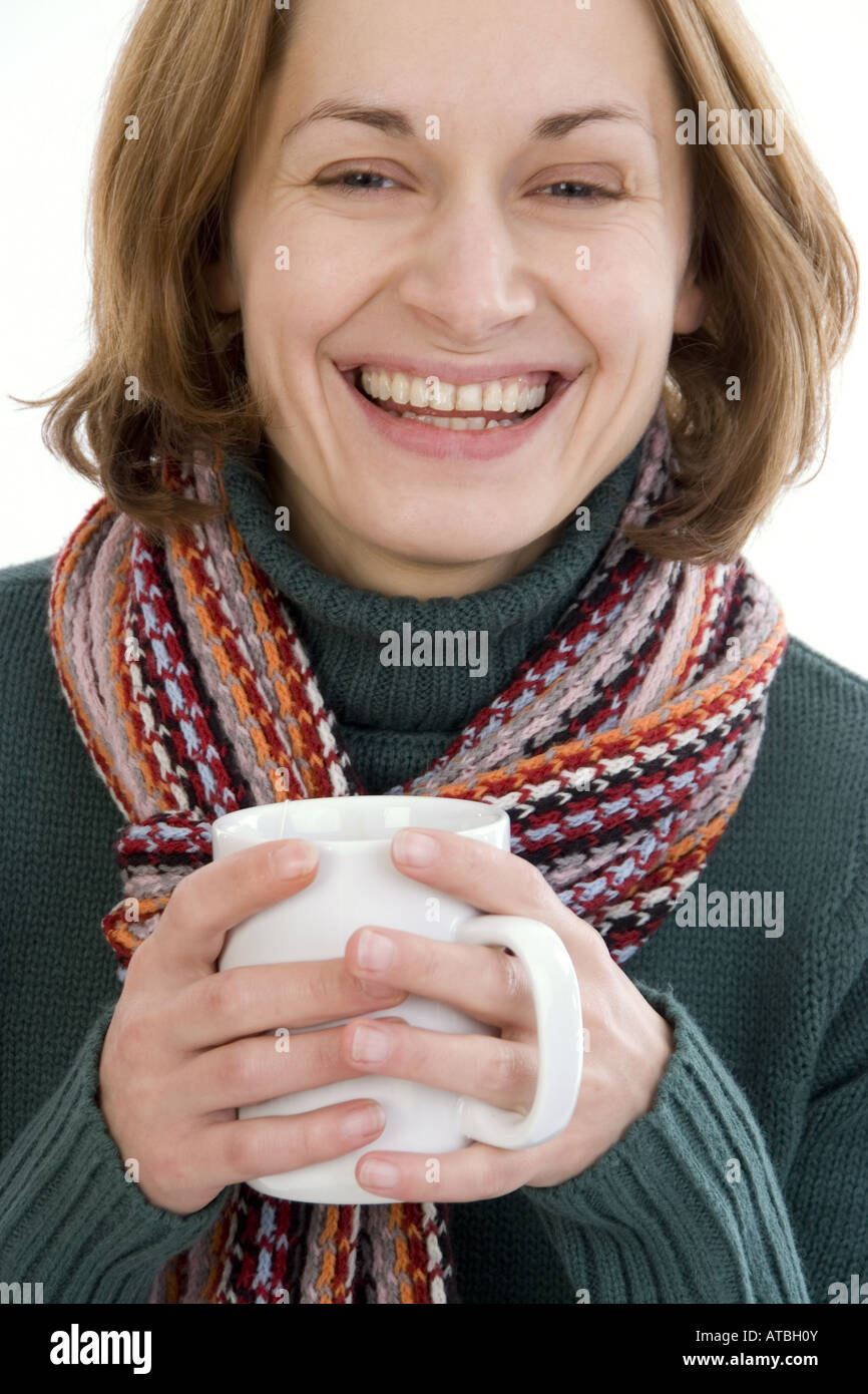 young woman with a cup of tea, laughing happily Stock Photo - Alamy