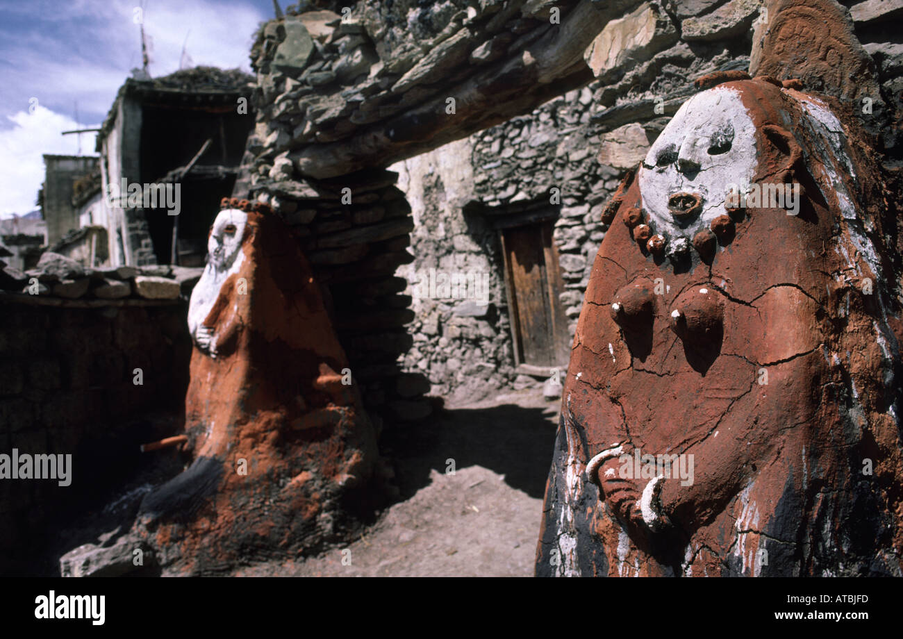 Animist mud statues adorn a village entrance. Jharkot, Annapurna area ...