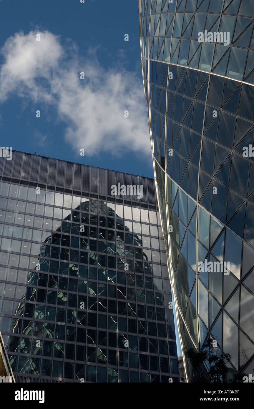 the gerkin reflected in a neighbouring office block Stock Photo - Alamy