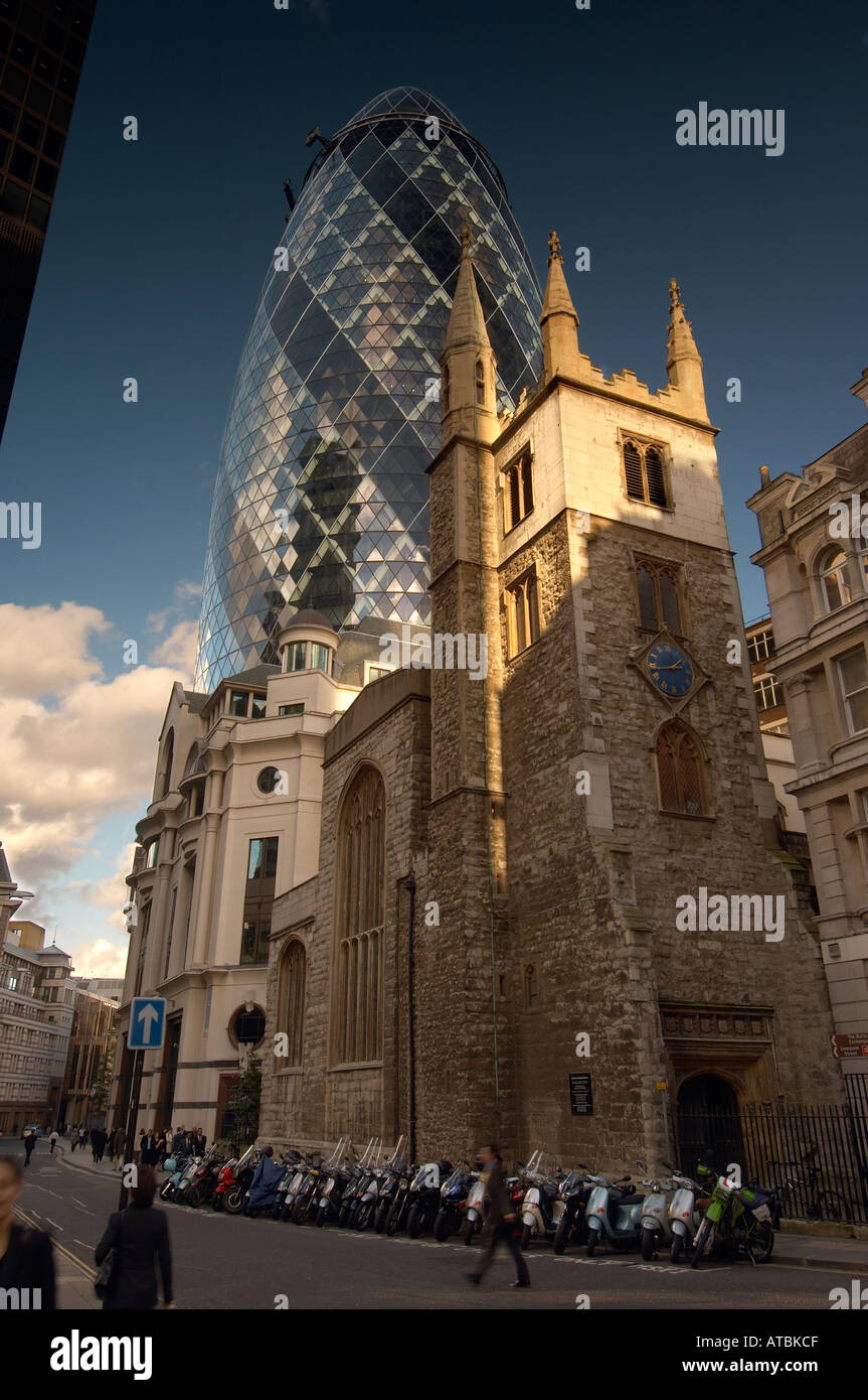 st mary axe with the Swiss Re (gerkin} behind it against a blue sky ...