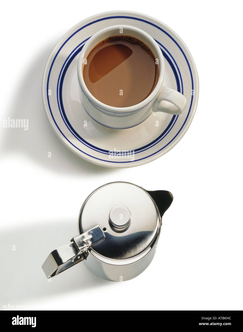 A cup of coffee and a pot of milk Stock Photo - Alamy