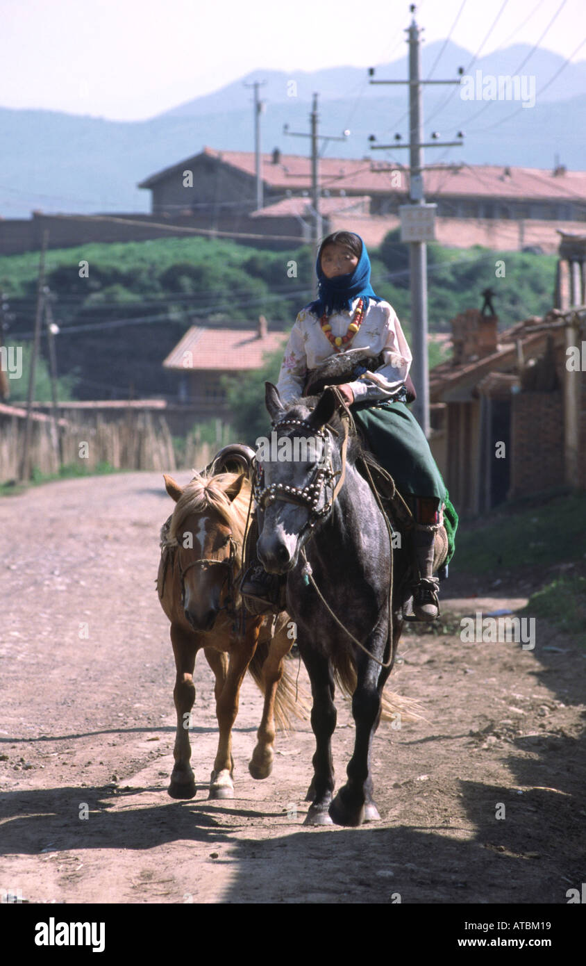 Chinese young woman riding horse hi-res stock photography and images ...