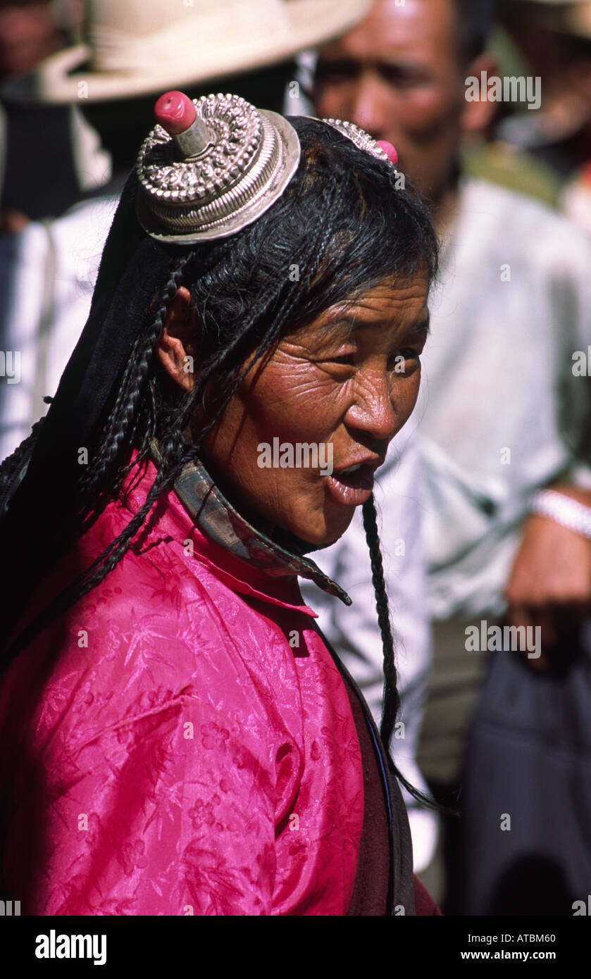 Khampa woman in traditional clothes. Litang, Sichuan, China Stock Photo ...