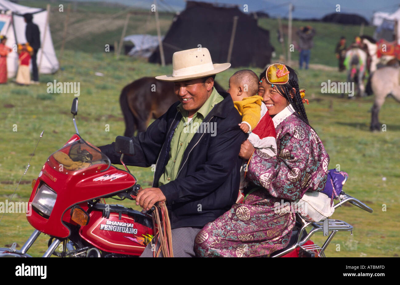 Tibetan man traditional dress on bike hi-res stock photography and ...