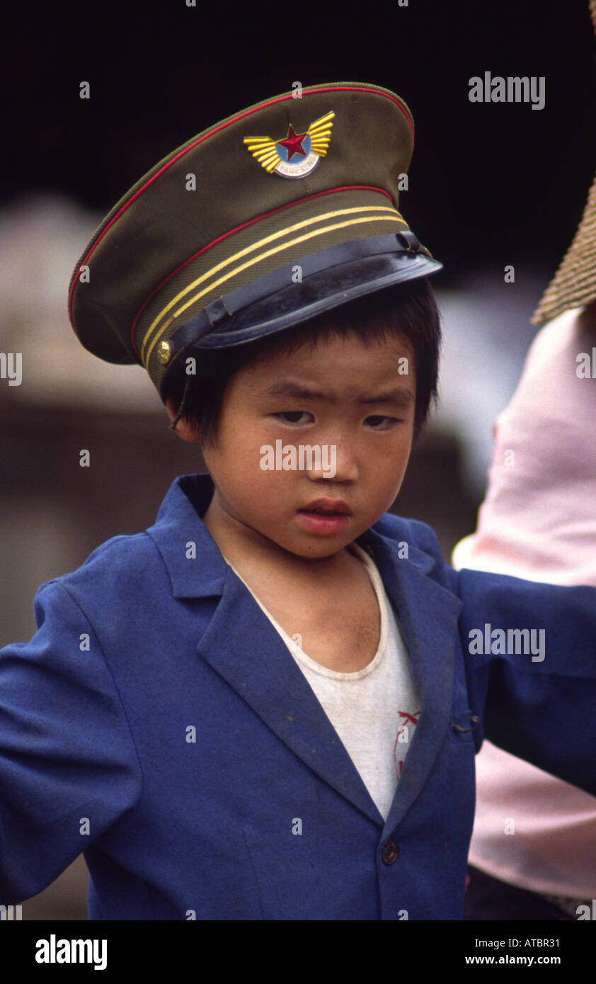 Boy with army hat. Xichuanbanna, Yunnan, China Stock Photo - Alamy