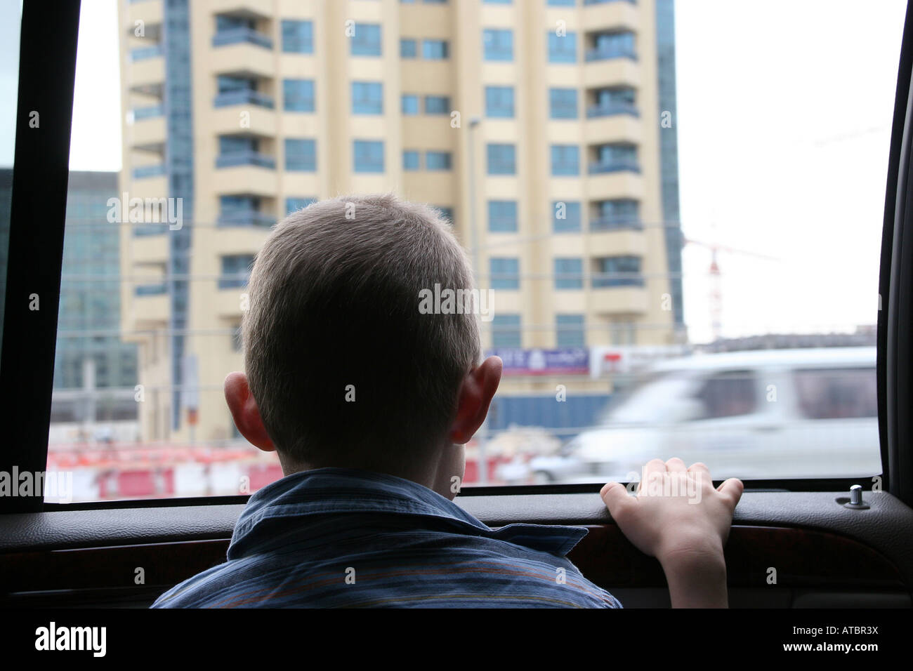 Child looks out of the car-window Stock Photo - Alamy