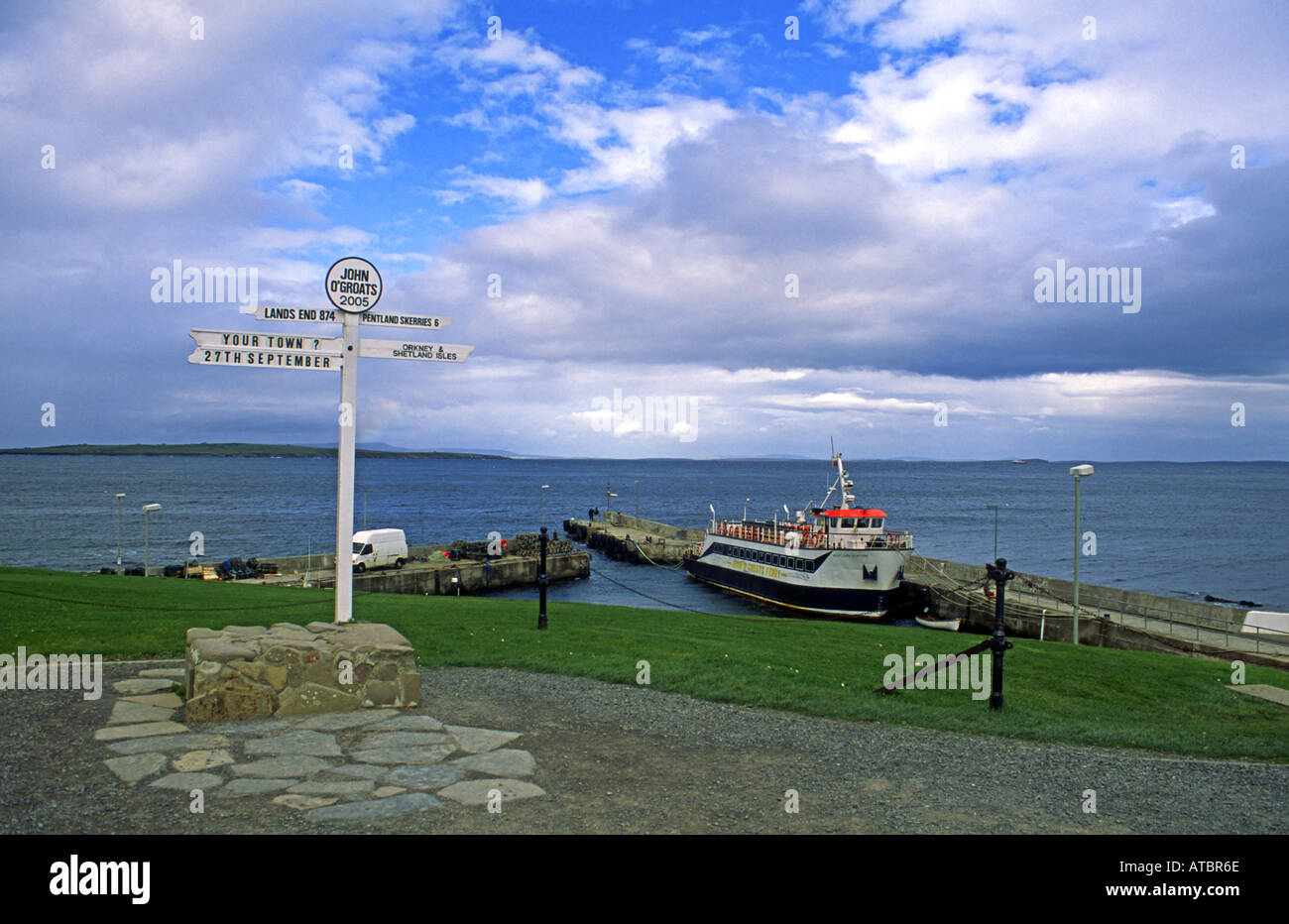 The famous signpost and harbour at John O'Groats North Scotland Stock ...