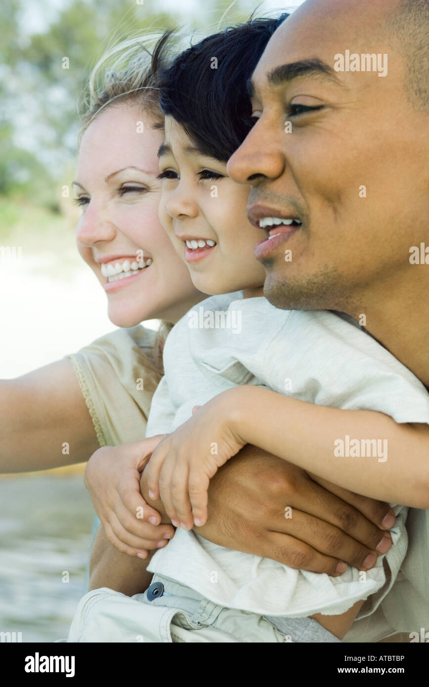 Family looking away together, smiling, side view Stock Photo - Alamy