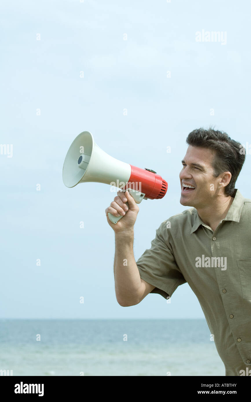 Man standing by the sea, shouting into megaphone, close-up Stock Photo ... Man standing by the sea, shouting into megaphone, close-up Stock Photo ...