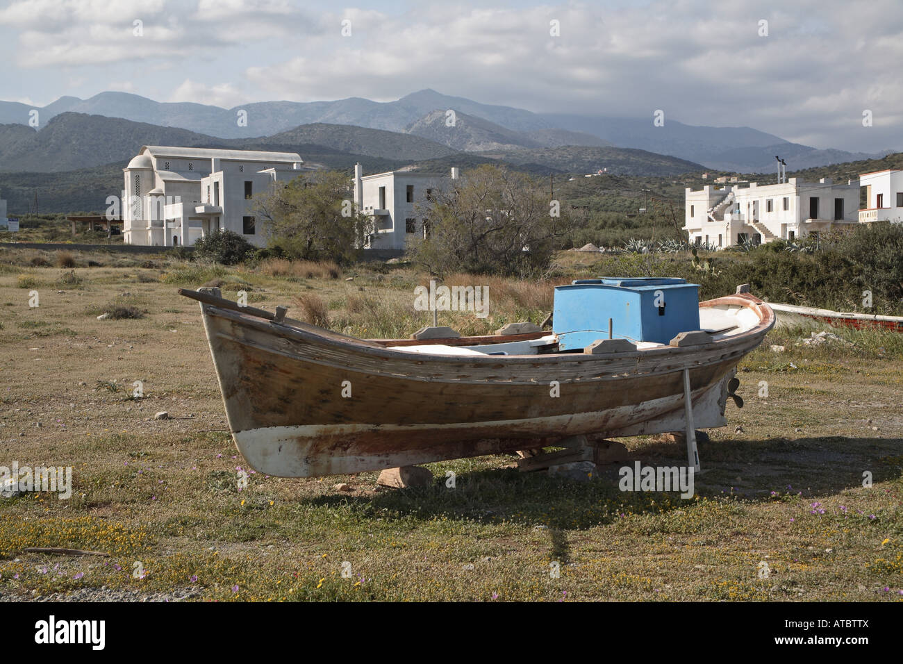 old fishing boat on land in front of an orthodox church and new ...