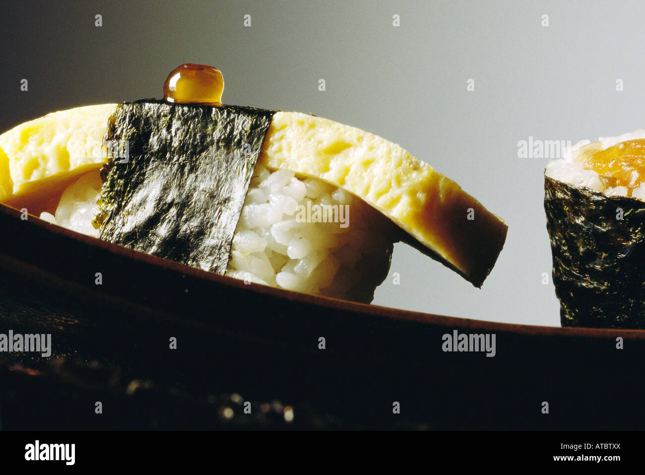 Tamago sushi with fish roe, extreme close-up Stock Photo - Alamy