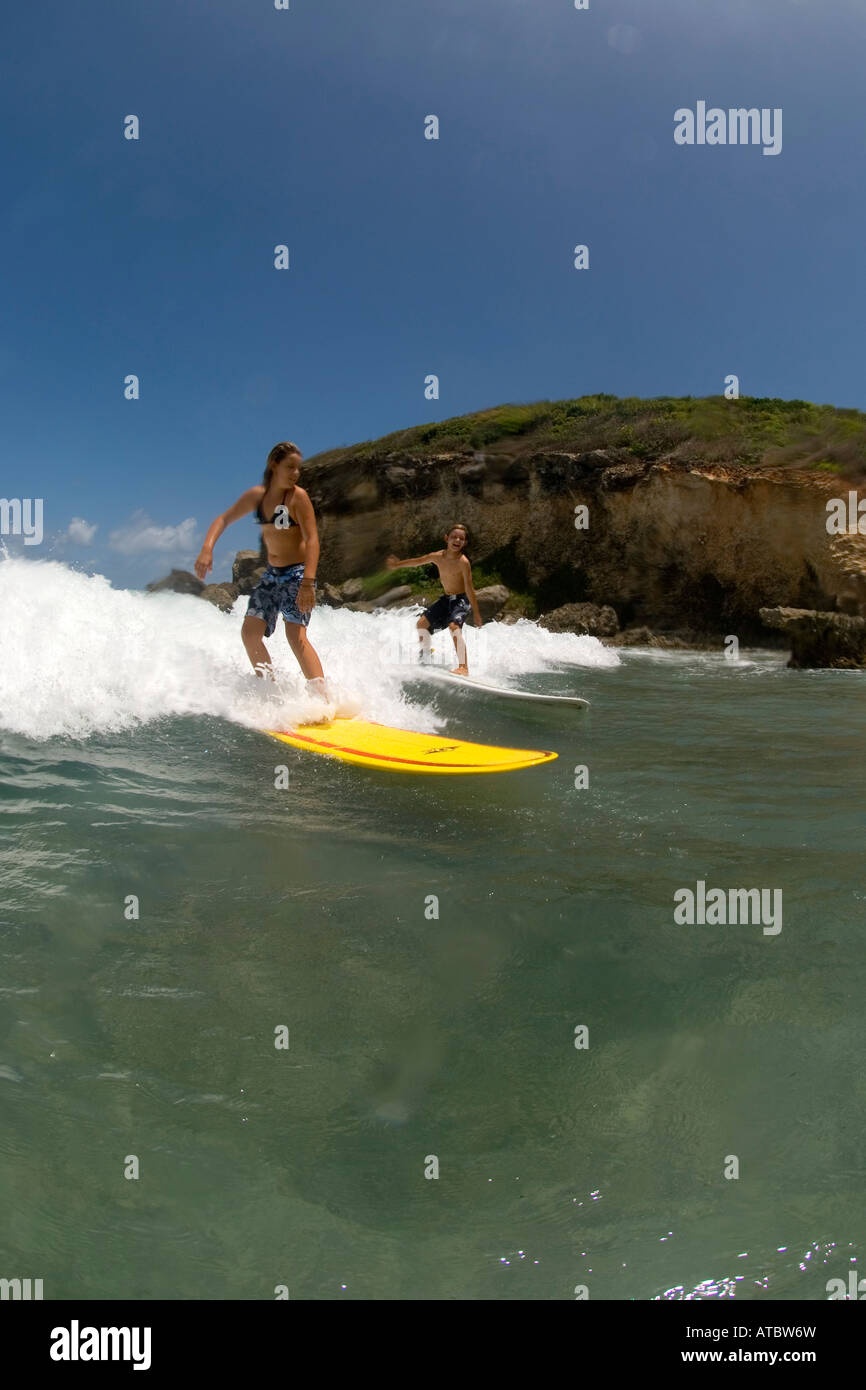 Kid surfing in the Caribbean, summer, holiday, vacation, water sport ...