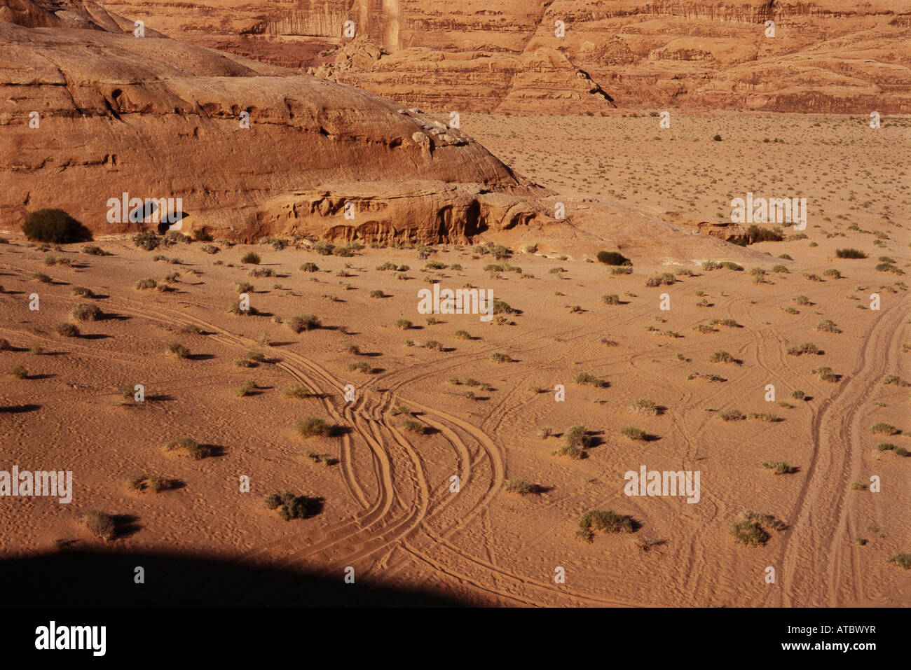 Tire tracks in desert landscape Stock Photo - Alamy