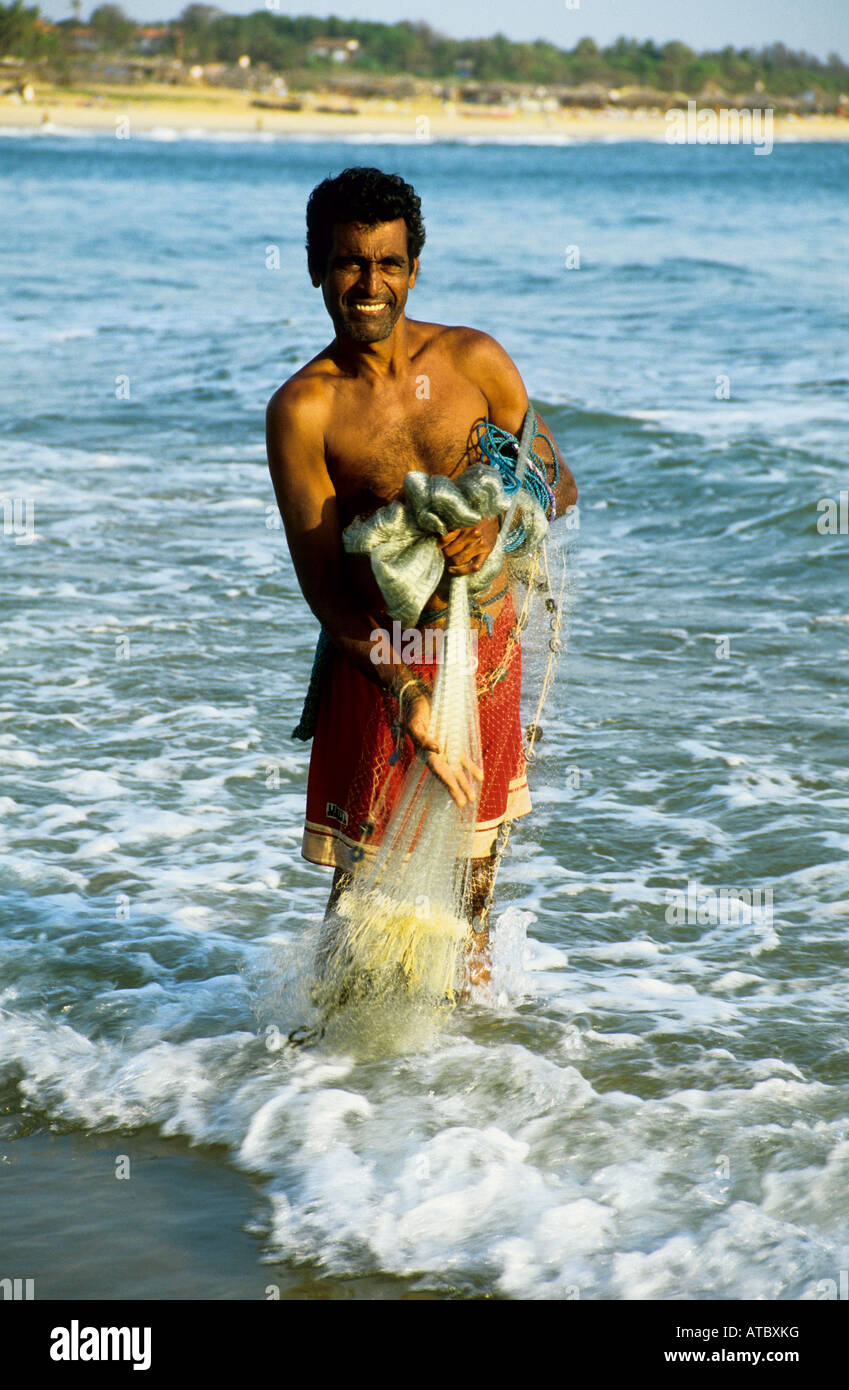 Fishing with a net on a Goan beach, India Stock Photo - Alamy