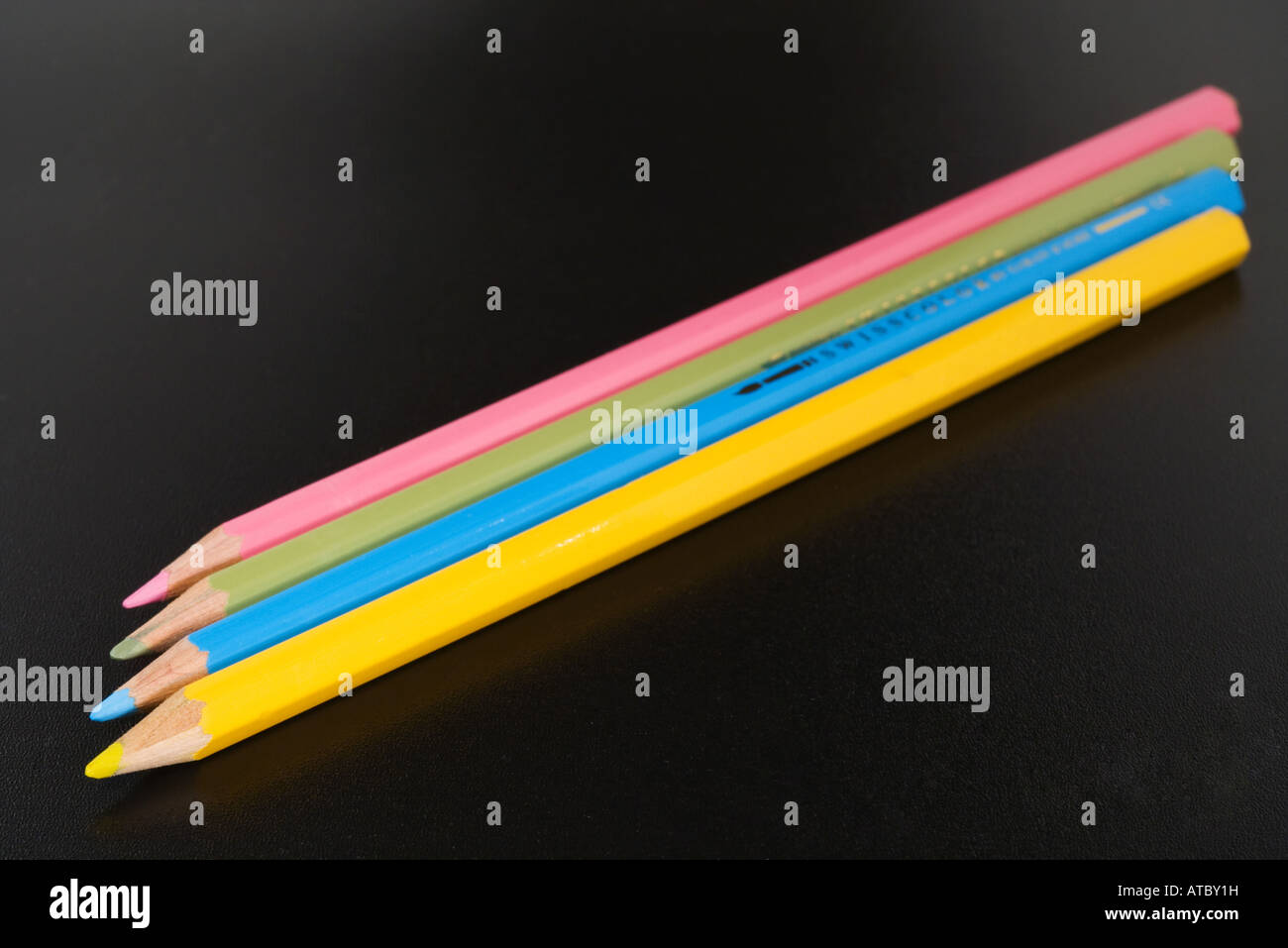 Four colored pencils side by side, close-up Stock Photo - Alamy