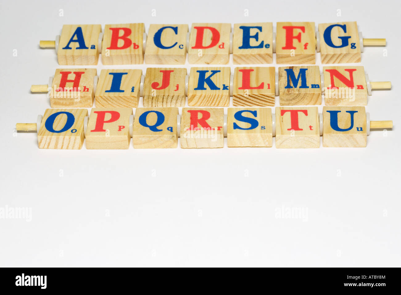 Wooden alphabet blocks in rows, close-up Stock Photo - Alamy