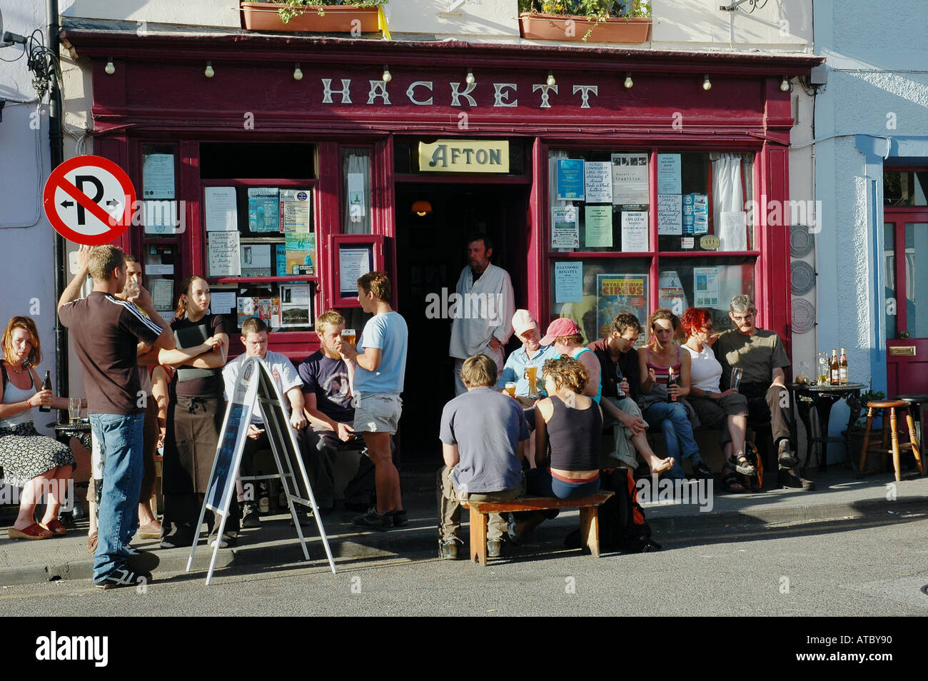 Hacketts Pub in Schull Co Kerry. Holiday makers and boat people mingle ...