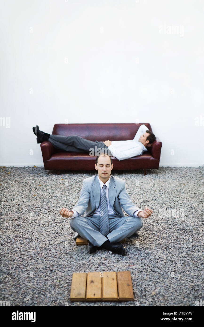 Man in suit lying on floor hi-res stock photography and images - Alamy