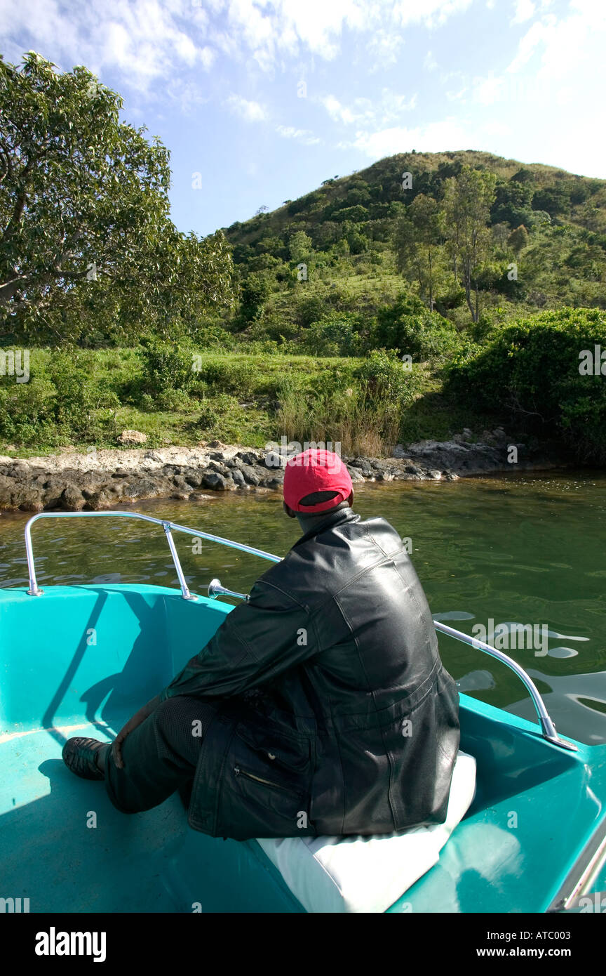 A holidaymaker takes a boat trip on Lake Kivu in Rwanda Central Africa ...