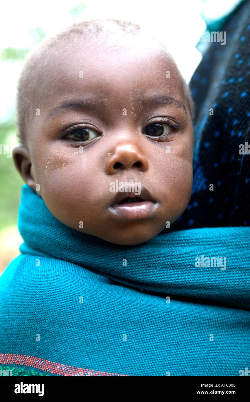 A Rwandan baby is carried on her mother s back near Lake Kivu in Rwanda ...