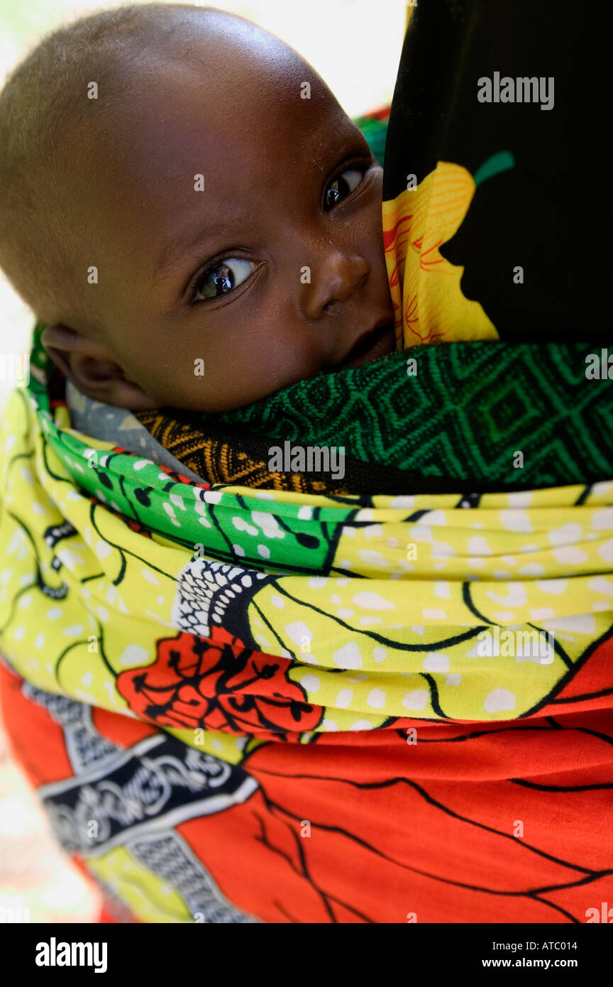A Rwandan baby is carried on her mothers back in Rwanda Central Africa ...