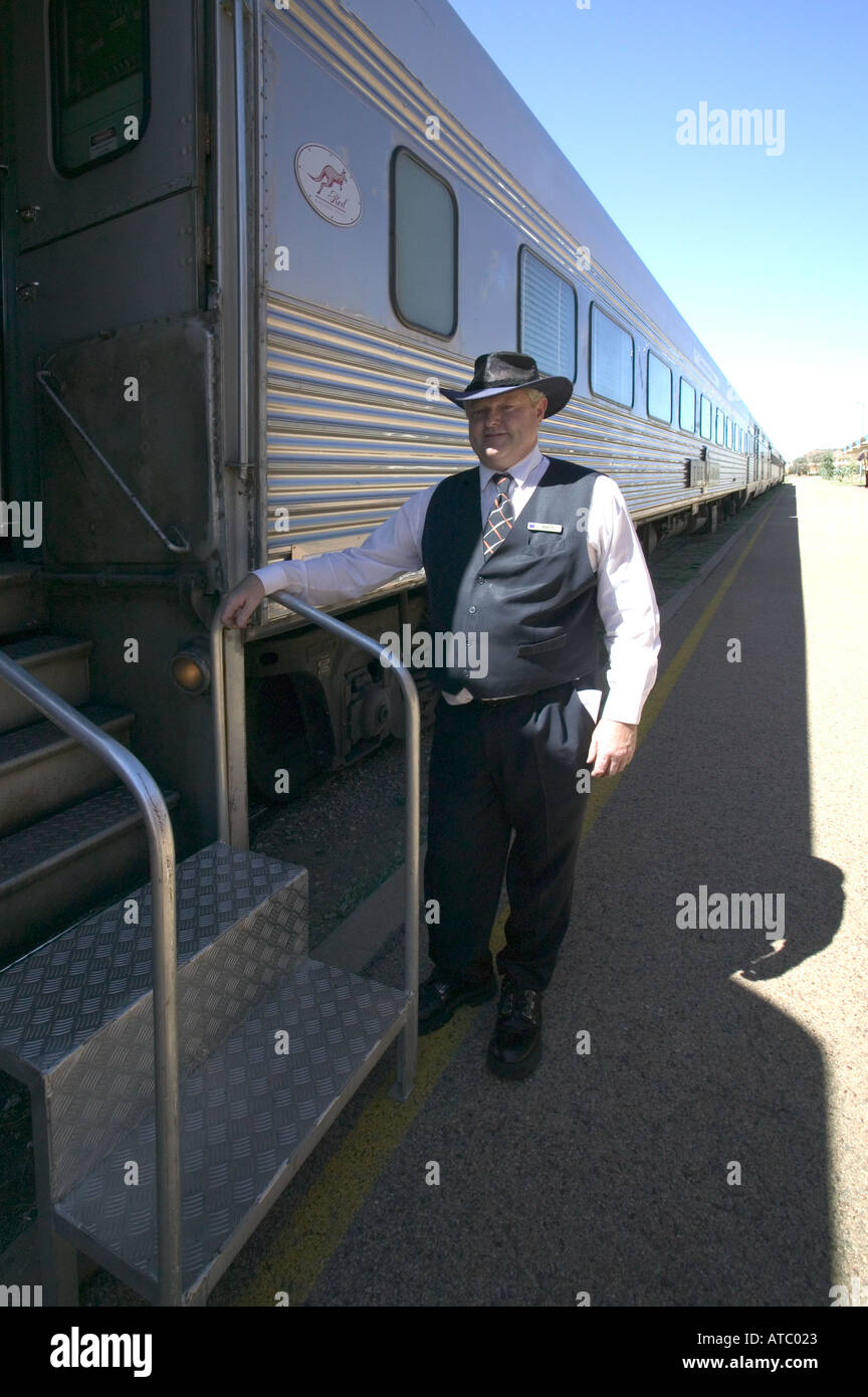 A steward welcomes passengers on board the Ghan train as it stops in ...
